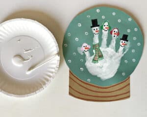 Snow Globe Craft with Handprints - childhoodmagic.com