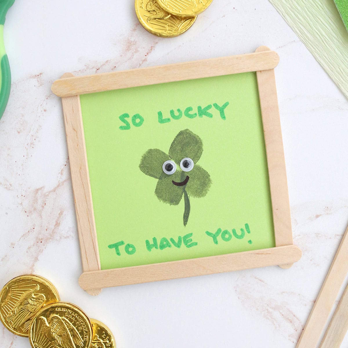 St. Patrick's Day Shamrock Fingerprint Craft - childhoodmagic.com