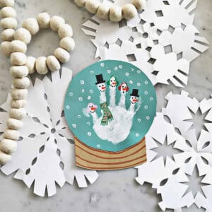Snow Globe Craft with Handprints - childhoodmagic.com